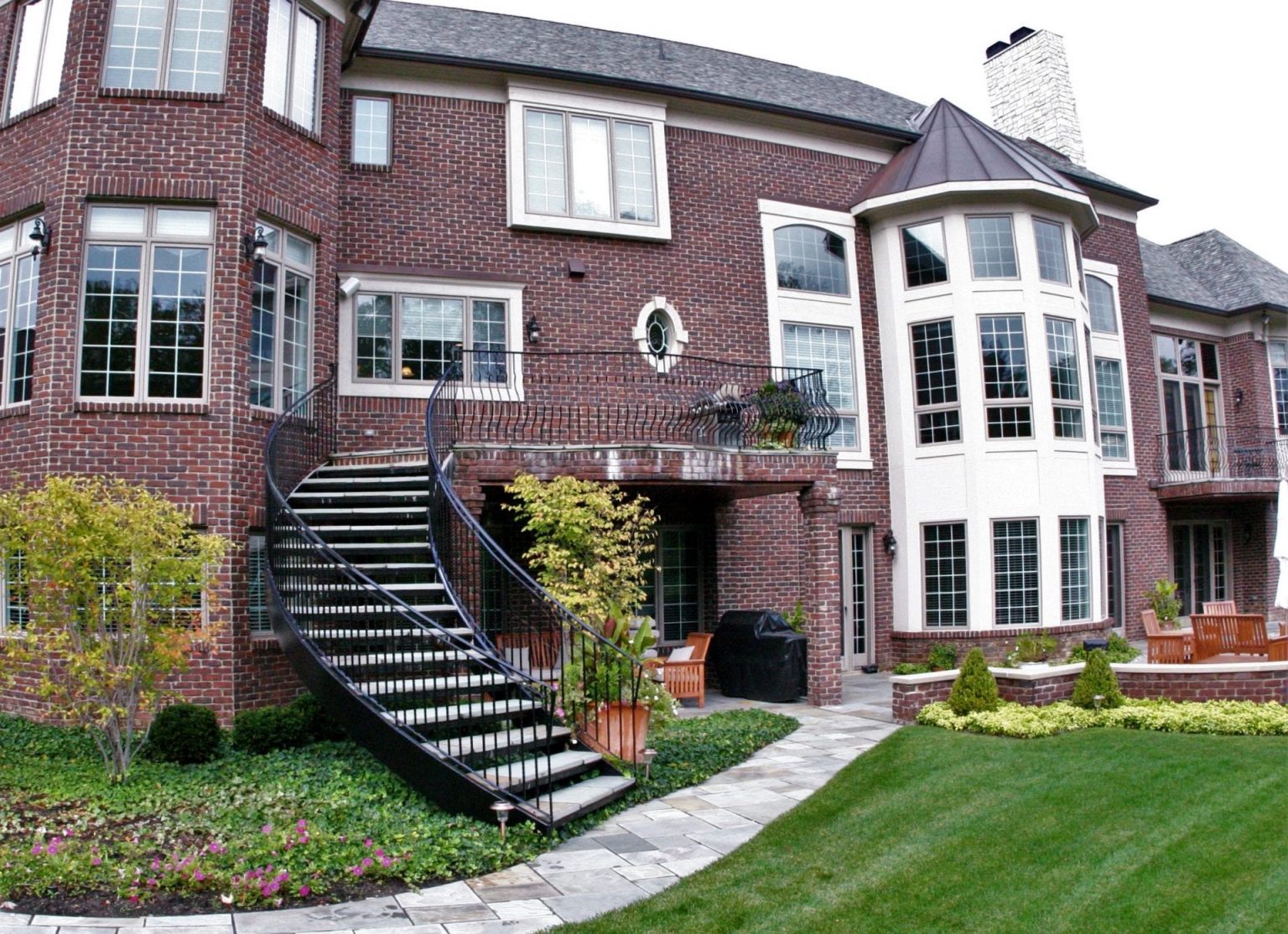 Outdoor Curved Staircase with Wrought Iron Belly Rail Outdoor Curved Staircase with Wrought Iron Belly Rail